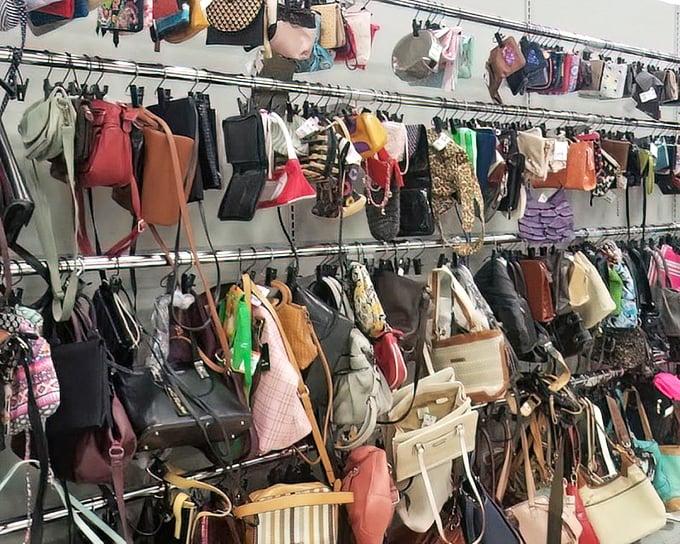 Handbags in every color and style dangle like fashion fruit ripe for picking, each one carrying stories from previous adventures.