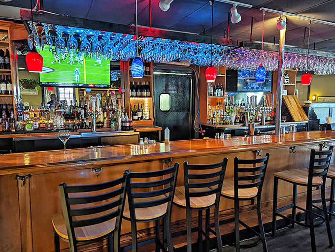 The bar area glows with possibility&mdash;where strangers become friends and wine glasses are always at least half full, never half empty.
