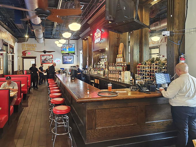 The well-stocked bar area, with its classic red stools, offers the perfect perch for pre-dinner drinks or post-lobster libations.