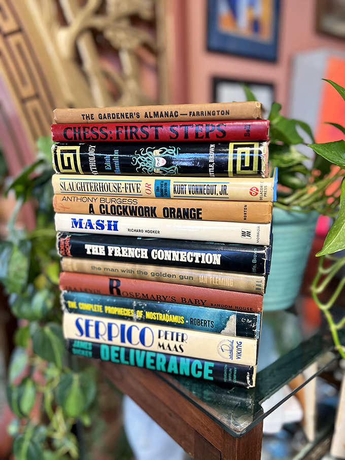 Book spines telling stories before you even crack them open &ndash; Vonnegut, Fleming, Burgess stacked like a hipster's dream reading list.