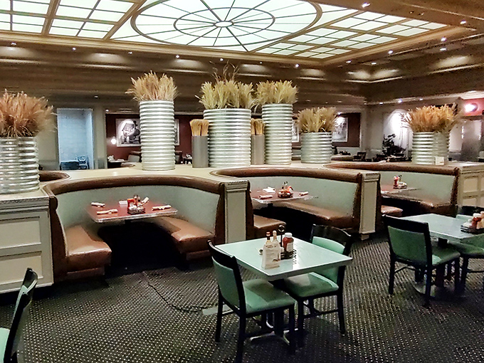 Curved booths cradle food-coma victims in comfort. Those wheat stalks aren't just decoration—they're a reminder of the farm-to-table journey your breakfast took.