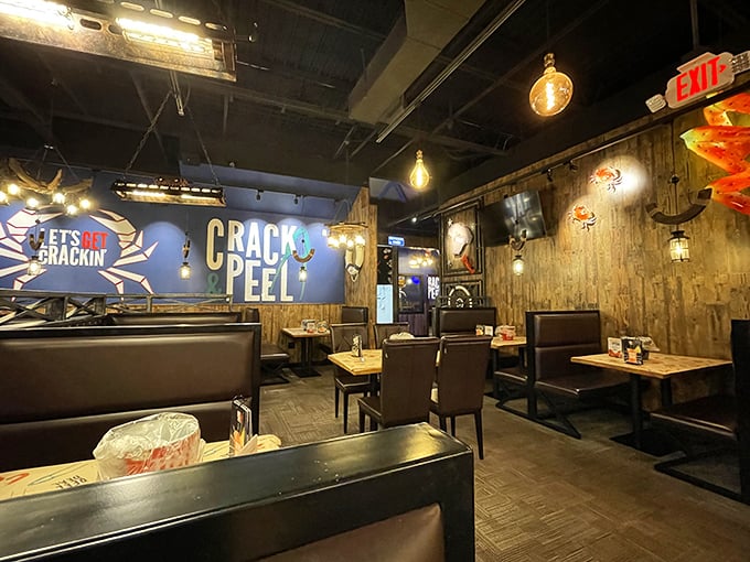 Dark wood booths and "Crack & Peel" wall art—subtle reminders of the delicious work that lies ahead.