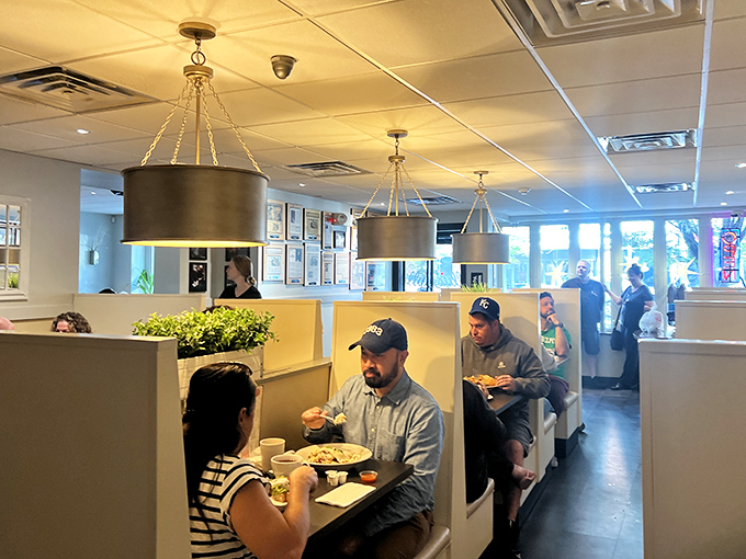 Booth seating with modern pendant lighting creates the perfect spot for a leisurely weekend breakfast with friends or family.