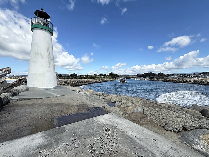 From the harbor side, Walton Lighthouse reveals its true purpose &ndash; guiding vessels safely home through the narrow channel.