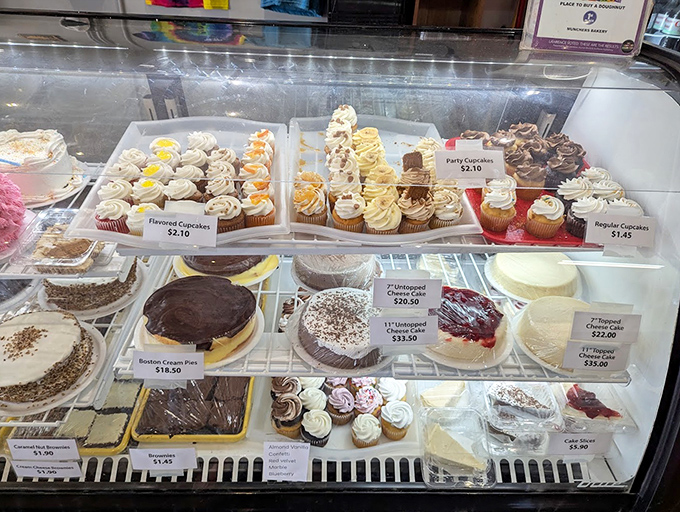The cake display case: where birthdays get better and Tuesdays become special occasions. Life is short; eat the cake.