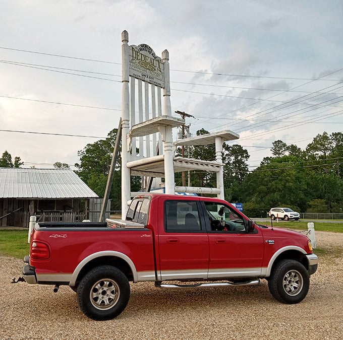That red pickup looks like a toy car next to this mammoth piece of porch furniture.