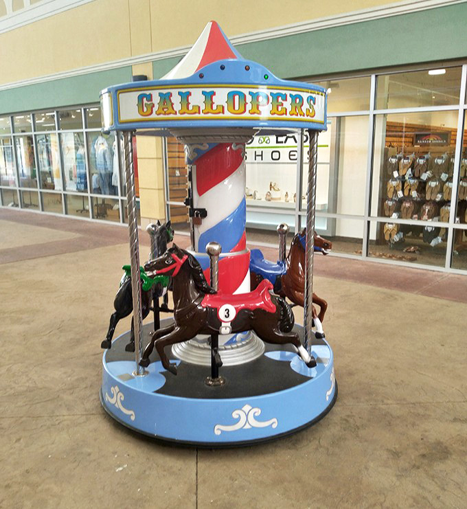 This mini-carousel offers a moment of whimsy between shopping conquests. Even horses know the importance of a good retail break.