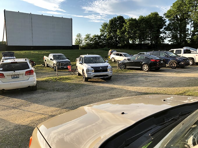 Rows of vehicles create a community of movie lovers, each car its own private theater in this shared experience.