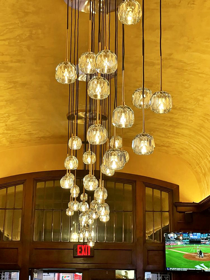 This chandelier installation isn't just lighting &ndash; it's jewelry for the ceiling, casting a glow that makes everyone look like they've just returned from vacation.