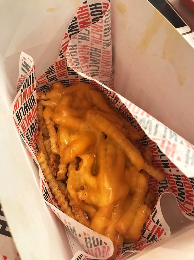Crinkle-cut fries smothered in molten cheese&mdash;the comfort food equivalent of a warm hug after the spicy chicken assault on your taste buds.