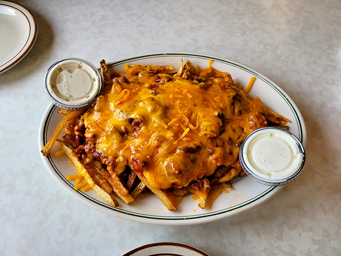 Chili cheese fries: where the food pyramid goes to take a delicious vacation. Worth every napkin and the occasional cheese pull photo opportunity.