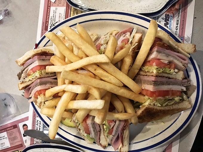 A club sandwich that requires jaw exercises before attempting. Stacked higher than a history book about Gettysburg itself, with french fries as the perfect sidekick.