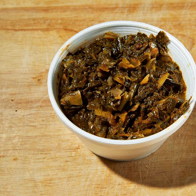 Collard greens that have been cooking so long they've developed their own philosophy on life. Deep, complex, and surprisingly wise.