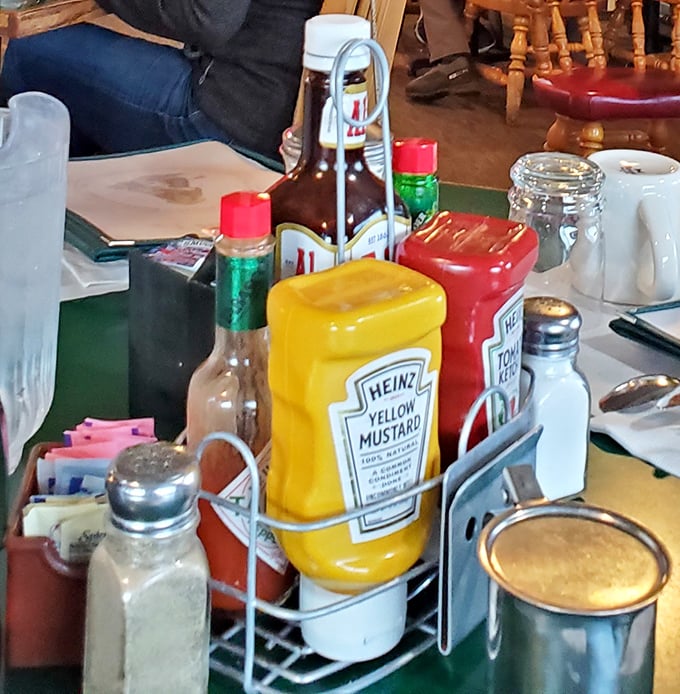 The condiment caddy &ndash; that unsung hero of diner tables everywhere, holding the power to customize your meal to perfection.