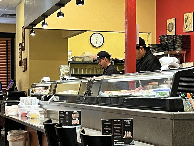Sushi chefs in their element &ndash; part artist, part culinary scientist. The concentration on their faces says everything about their craft.