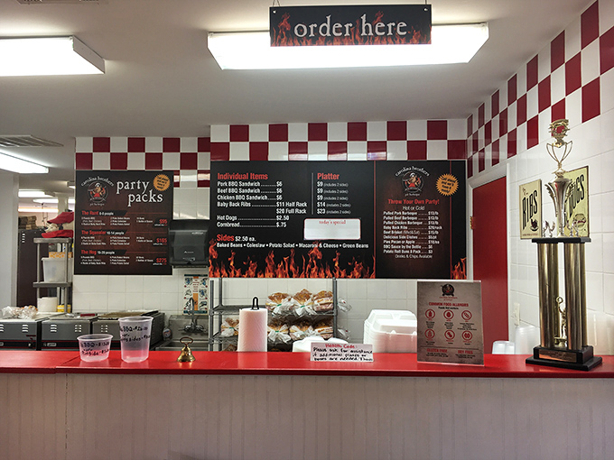 The checkered wall says "classic barbecue joint," but the trophy says "we're not just playing around with these smokers."