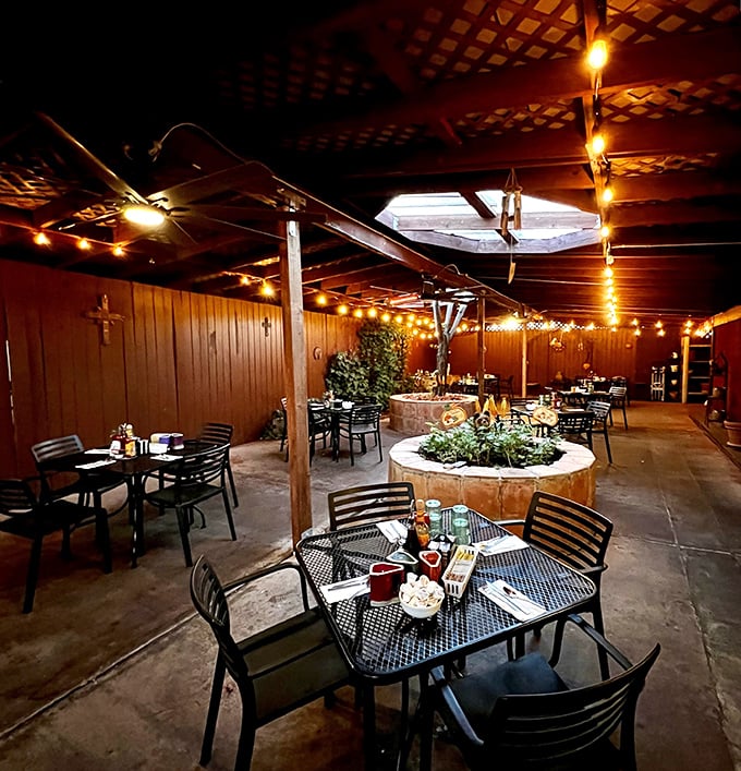 The covered patio offers string lights and outdoor seating for those perfect Arizona mornings under the desert sky.