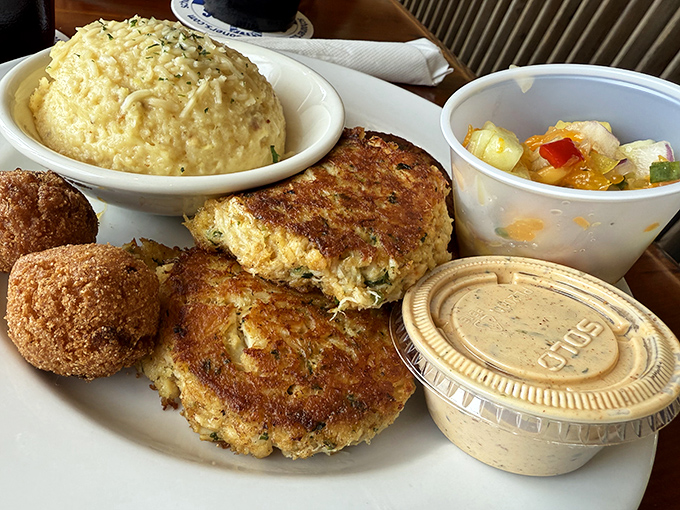 These crab cakes don't hide behind fillers &ndash; they're proudly showcasing their crabby credentials alongside creamy grits that would make any Southerner proud.