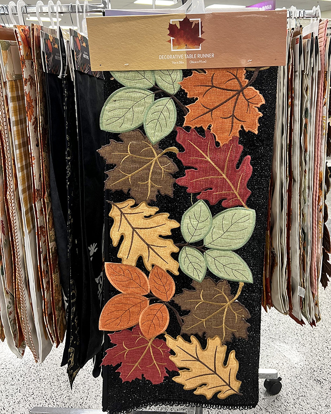 Fall's greatest hits, arranged on fabric! This seasonal table runner brings harvest warmth to your dining space with appliqu&eacute;d autumn leaves.