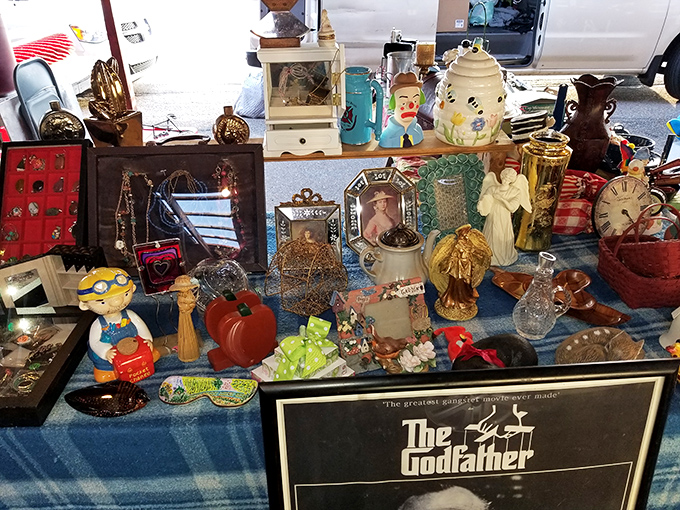 A tabletop time capsule where The Godfather poster watches over ceramic angels and vintage glassware. Your grandmother would approve of this eclectic collection.