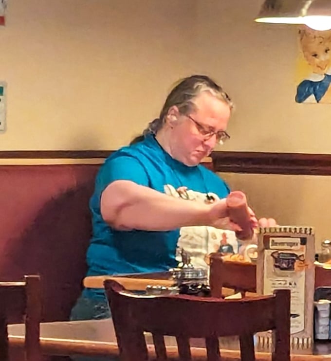A quiet moment in the diner&mdash;where regulars find their rhythm in the familiar routine of comfort food and friendly service.
