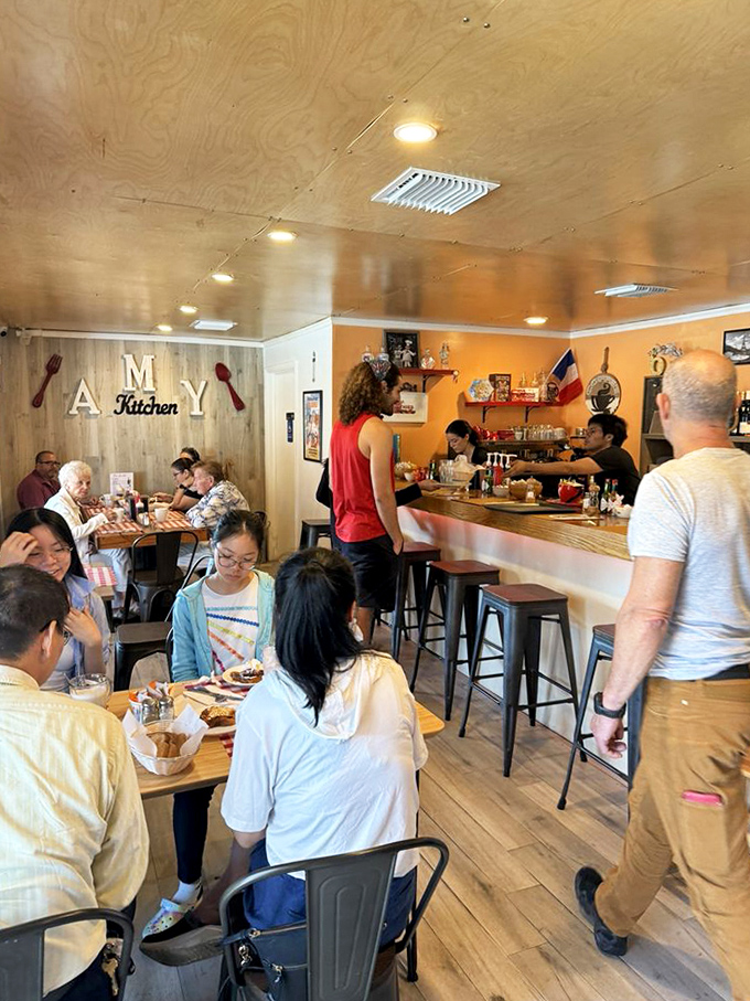 A bustling dining room where strangers become friends, united by the universal language of "Oh my goodness, you have to try this!"