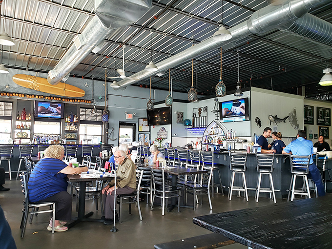 Regulars know the best seats in the house are often at the bar, where you can watch the orchestrated chaos of a busy seafood restaurant.