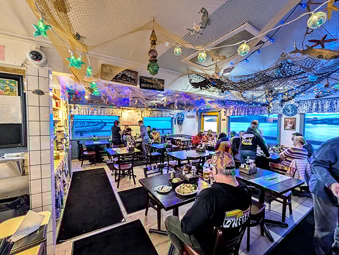 Happy diners enjoying their catch &ndash; because nothing says "good decision" quite like a table full of fresh seafood by the bay.