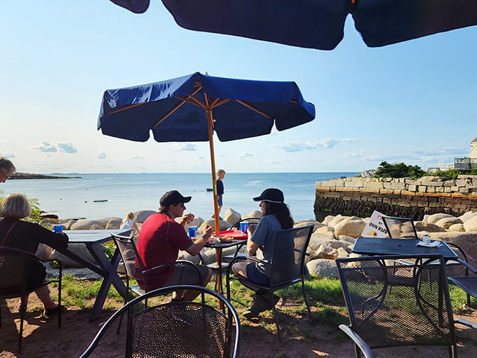 Dining with a side of vitamin sea. These lucky patrons have figured out the secret formula: fresh seafood + ocean views = peak happiness. 