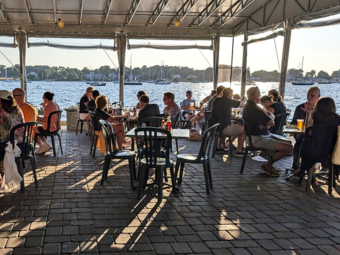 When the golden hour hits and the harbor sparkles, every table becomes the best seat in the house.