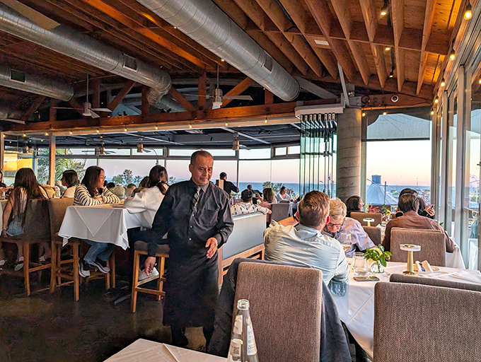 Where servers glide between tables like choreographed dancers, delivering oceanic treasures to eager diners as the Pacific sparkles beyond.