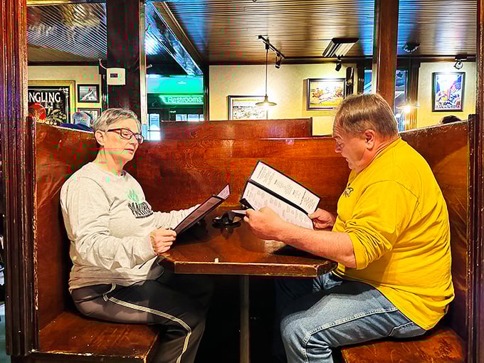 The classic booth experience&mdash;where important decisions are made, like whether to share dessert or order your own.