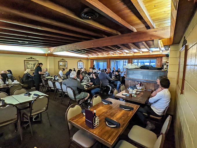 The dining room hums with conversation under wooden beams that have witnessed thousands of "happy birthdays" and "I'll have the usual" moments since Kennedy was president.