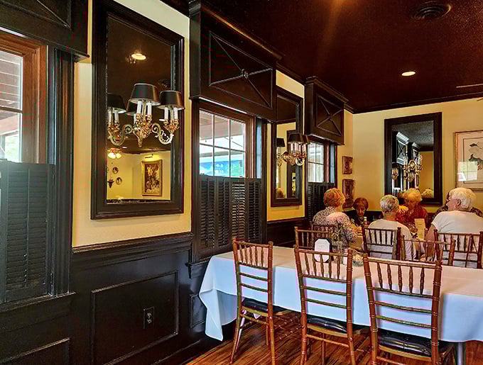 Elegant dining spaces where white tablecloths meet warm wood tones, creating that perfect balance between fancy and comfortable.