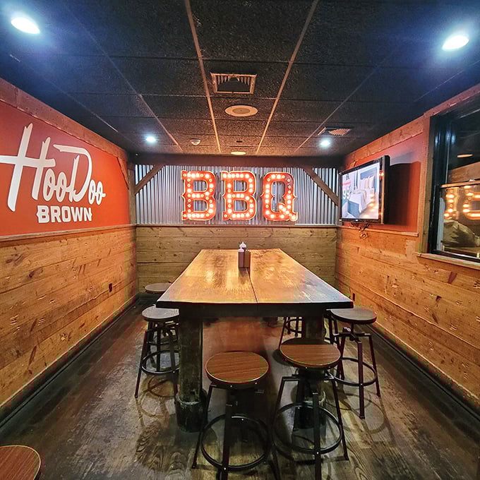 The "BBQ" sign glows like a neon promise. This private dining nook feels like you've discovered a secret barbecue society. The password? "More sauce, please."