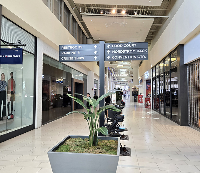 The directional signs that prevent shopping-induced panic attacks. "Food Court" and "Restrooms" – possibly the two most important words in any mall vocabulary.