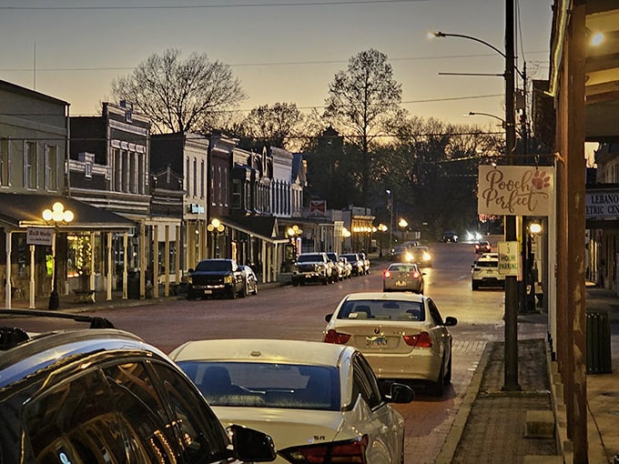 Lebanon's main street glows with vintage charm as dusk settles over the brick pavement. Twilight transforms ordinary storefronts into a Norman Rockwell painting come to life.