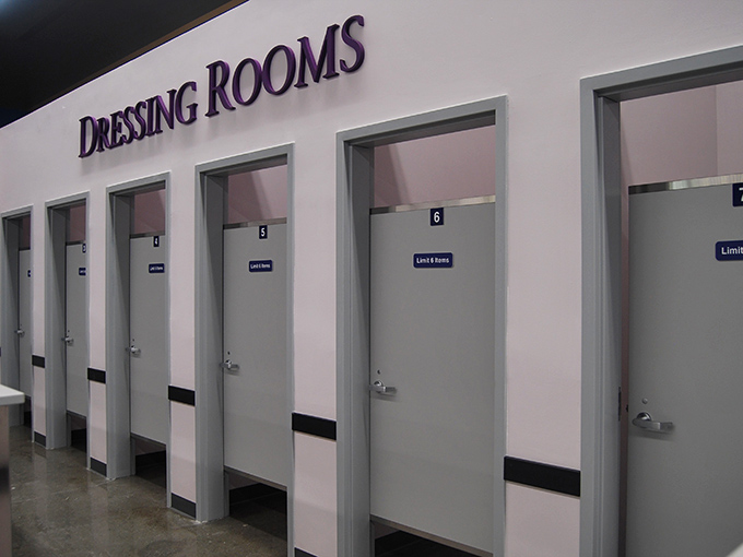 Dressing rooms where fashion dreams are tested against reality. The true moment of thrift shop triumph happens behind these humble doors.