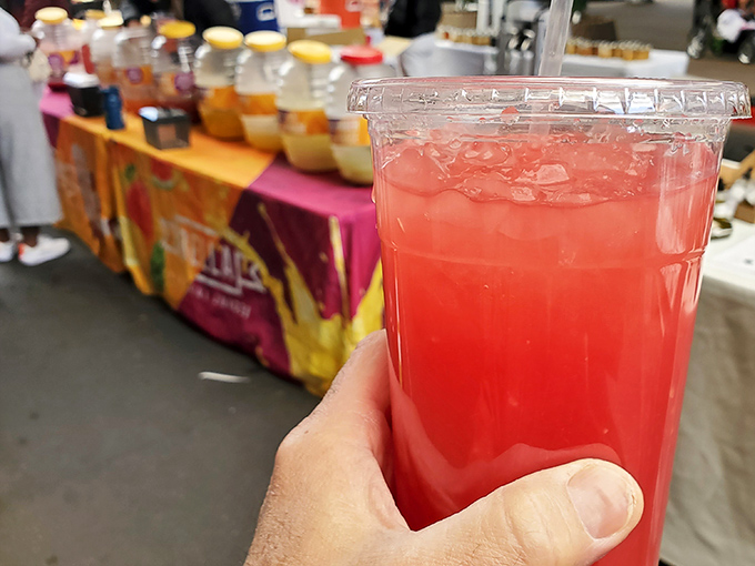 Refreshment in a cup! This vibrant pink beverage offers liquid relief from the Nevada heat, the perfect companion while browsing market stalls.