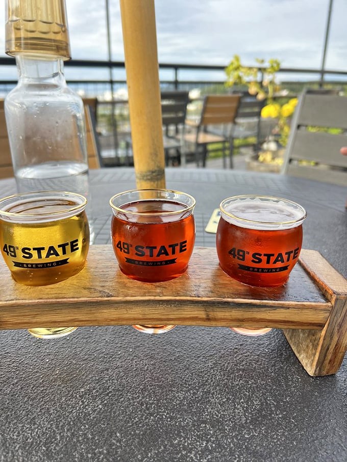 A flight of amber treasures showcasing Alaska's brewing prowess, with the outdoor deck view serving as the perfect chaser.