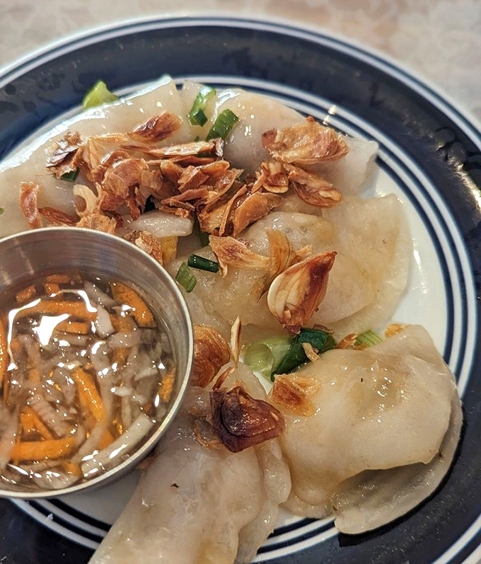 These translucent dumplings are like edible crystal balls—one bite predicts you'll be back for more, probably sooner than you think.