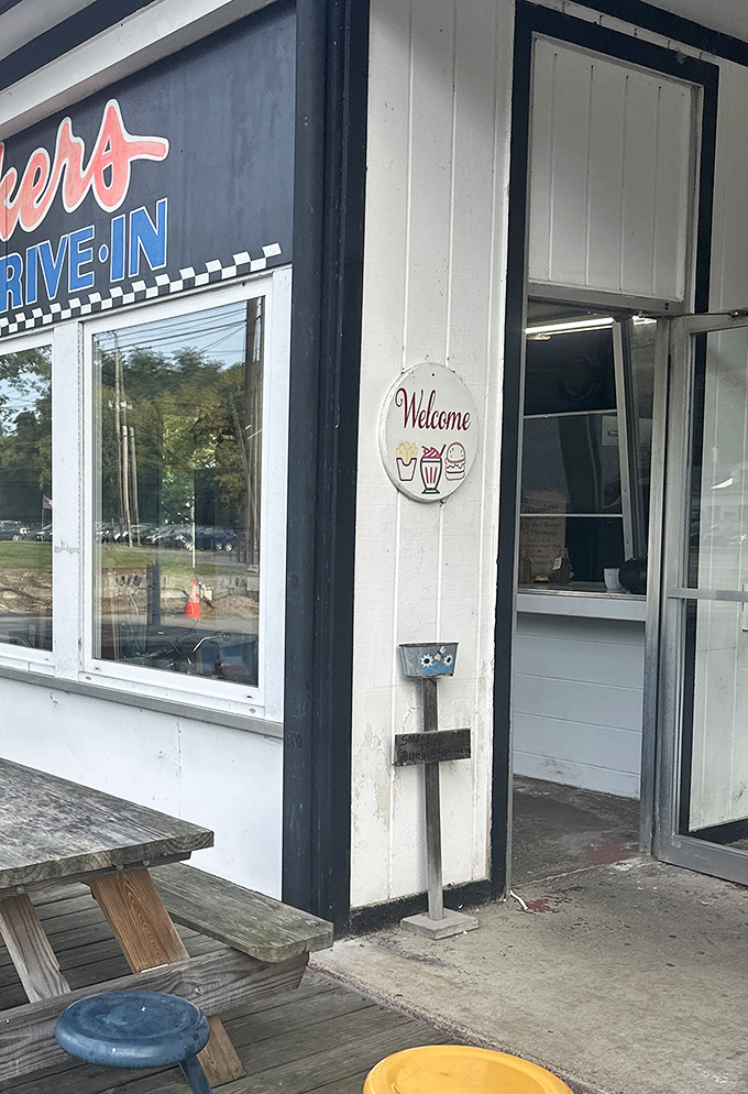 That "Welcome" sign isn't just polite&mdash;it's a promise of the burger bliss that awaits beyond the threshold.
