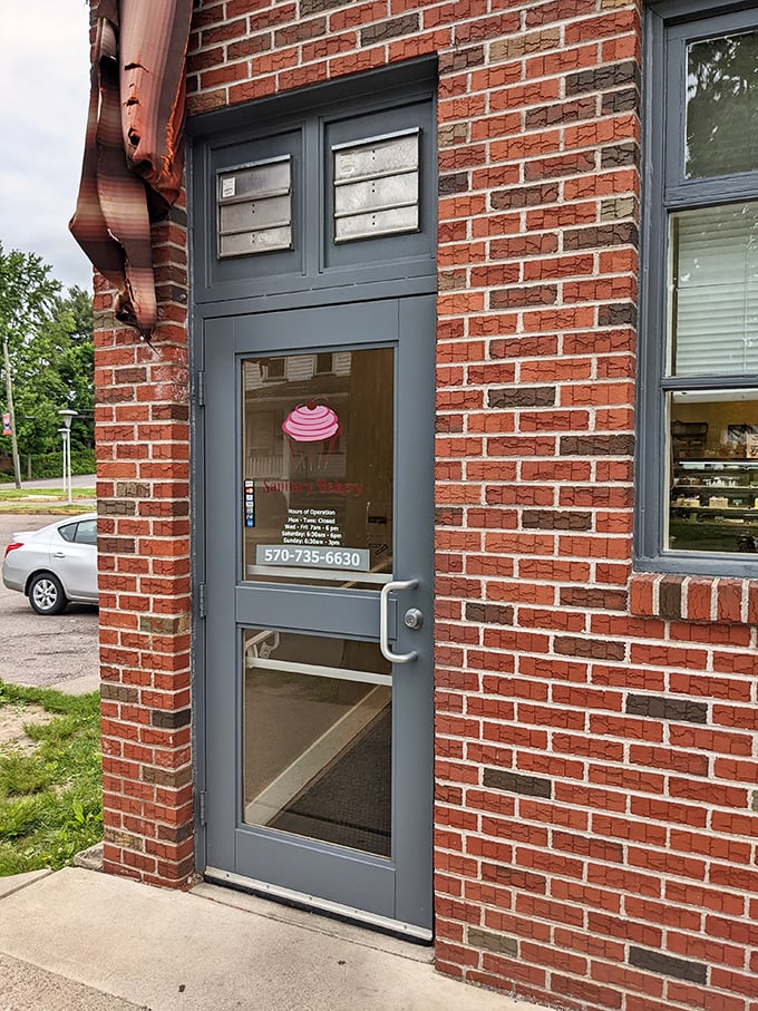The entrance to carbohydrate paradise. That pink cupcake logo is like a beacon guiding hungry souls to their delicious destiny.