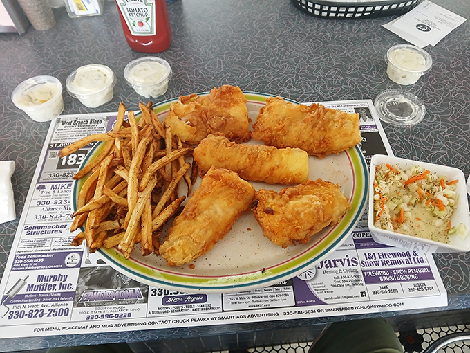 Golden-battered fish that shatters at first bite, alongside fries that clearly never saw the inside of a freezer. This is the kind of plate that silences conversation. 