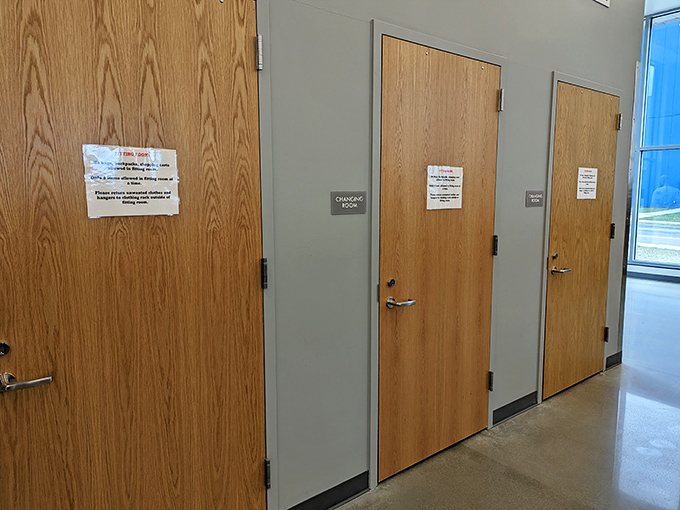 Behind these doors lie fitting rooms where thrift store possibilities transform into "I can't believe I found this" realities.