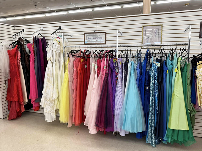 A rainbow of formal dresses waiting for their next big night&mdash;prom dreams and wedding guest outfits at a fraction of department store prices.