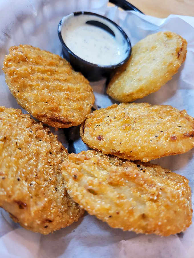 Golden-fried discs of southern comfort that make you question why green tomatoes ever bother ripening. That dipping sauce deserves a Nobel Prize.