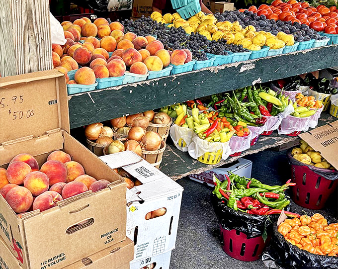 Summer's bounty captured in wooden crates&mdash;these peaches, grapes, and peppers weren't designed by marketing teams but perfected by generations of local farmers.