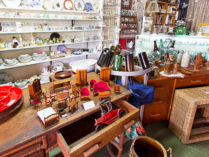 Miniature masterpieces among the bottles and bowls. That tiny dollhouse furniture holds impossibly small dreams from another era.