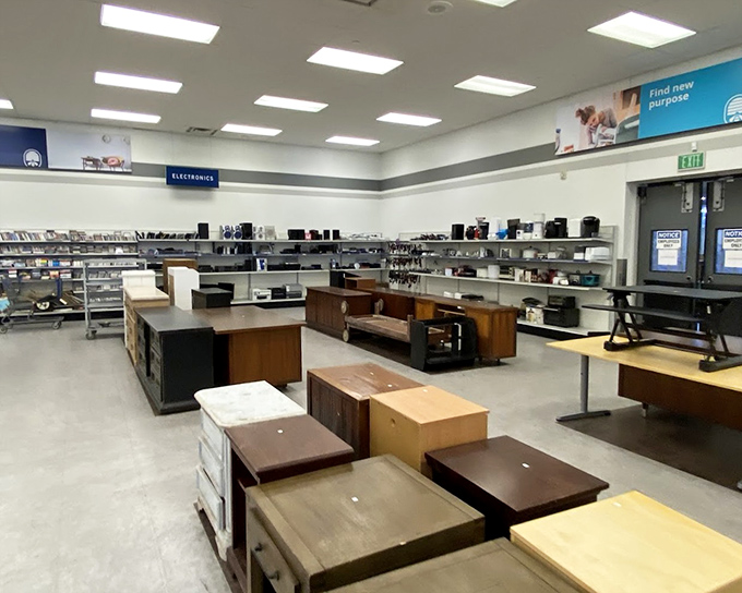 The furniture section: an IKEA showroom's more affordable, character-filled cousin, where solid wood desks await their next productive chapter.